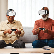 Friends, vr and senior men gaming in home on sofa in living room while ...