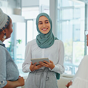 Business meeting, team and muslim woman with tablet for marketing ideas ...