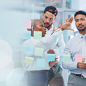 Meeting, collaboration and sticky notes with a business man training a ...