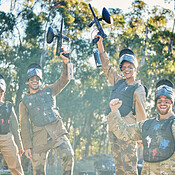 Team, paintball and portrait in celebration for winning, victory or ...