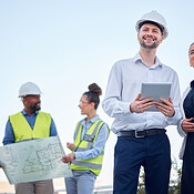 Outdoor, blueprint and architecture people planning, teamwork and ...