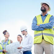 Proud engineering man or manager outdoor planning, thinking of construction job and project ...