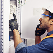 Man, phone call and engineering in control room, switchboard or ...