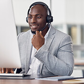 Black man, call center and computer with headset for telemarketing ...