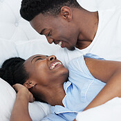 Happy black couple in bedroom kiss and smile for love, romance and ...