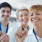 Doctor, happy team and writing healthcare strategy for schedule ...