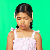 Sad, depression and face of child on green screen with upset ...