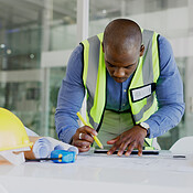 Architect tablet, drawing or black man planning infrastructure design ...