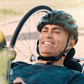 Happy man with disability, handcycle and bike for sports, race or ...