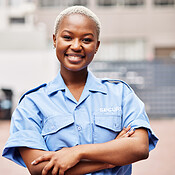Portrait, black woman and security guard smile with arms crossed in ...