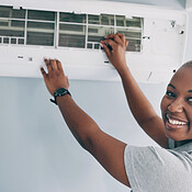 Portrait, black woman and electrician for ac repair, electrical box and ...