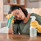 Tired woman, housekeeper and headache with detergent for cleaning ...