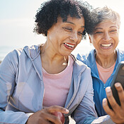 Senior women, phone and social media in nature for a chat, notification ...