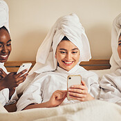 Spa day, sleepover and friends with phone in bed relax with social ...