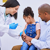 Kid, dad and woman doctor with syringe for vaccine, flu shot or ...
