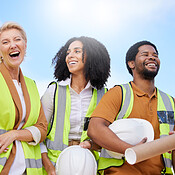 Team, architecture and people are laughing, construction and ...