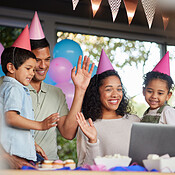 Family video call, birthday party and children by laptop, cake or ...