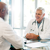Medical team, meeting and doctor speaker in a hospital conference room ...
