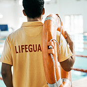 Swimming pool lifeguard, back and person with lifebuoy safety equipment ...