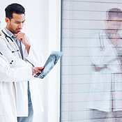 Window, doctors and conversation with scan, healthcare and neurosurgeon ...