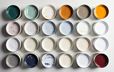 Top view of open multiple paint tins stacked in rows. Construction, diy ...