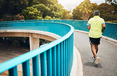Old man on bridge, running for fitness and cardio, back view with speed ...
