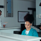 Reception people, tablet and doctor signature for administration ...