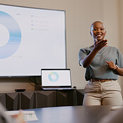 Business, black woman and infographic presentation on screen of data ...