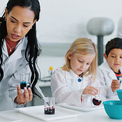 School kids, science and class with teacher, lab and learning ...