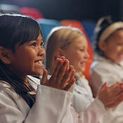 Children, applause and science show with smile, diversity and watching ...