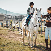 Woman leading girl on horse, ranch and equestrian sports, lady, child ...
