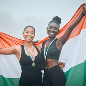 Winner portrait, flag and track sports team celebrate, excited and ...