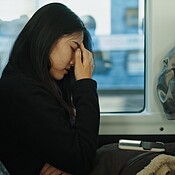 Train, tired and woman in city for travel, commute and journey on metro ...