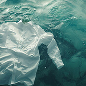 White shirt, water and laundry background for laundromat business ...