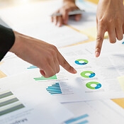 Hands, business people in meeting and data analysis, review paperwork ...