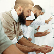 Muslim, religion ritual and men washing before prayer in bathroom for ...
