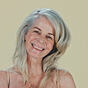 Face, skincare and elderly woman with a smile, wellness and cosmetics ...