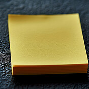 Memo, reminder and pile of sticky notes on table in office from above ...