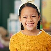 Smile, face and girl in classroom for education, learning and ready for ...