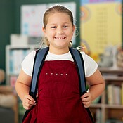 Smile, face and child in classroom for education, learning and ready ...