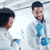 Two young science experts conducting a research experiment in the lab ...