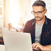 Getting a little work done at home | Buy Stock Photo on PeopleImages ...