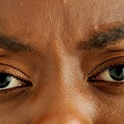 Confused, woman and closeup of eyes with frown for strain, optical care ...