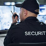Security guard, walkie talkie and speaking by cctv monitor for ...
