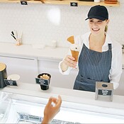 Woman, ice cream and customer with service, gelato and smile with ...
