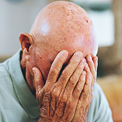 Senior man, sad and crying in home with depression, lost and stress ...