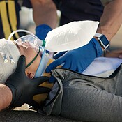 Paramedic, emergency and injury check on road from car crash accident ...