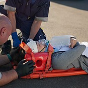 Outdoor, emergency and patient with paramedics, healthcare and rescue ...