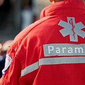 Paramedic, medical emergency and people by accident with first aid for ...