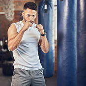 Strong boxer ready to punch in the gym. Portrait of mma fighter ready ...
